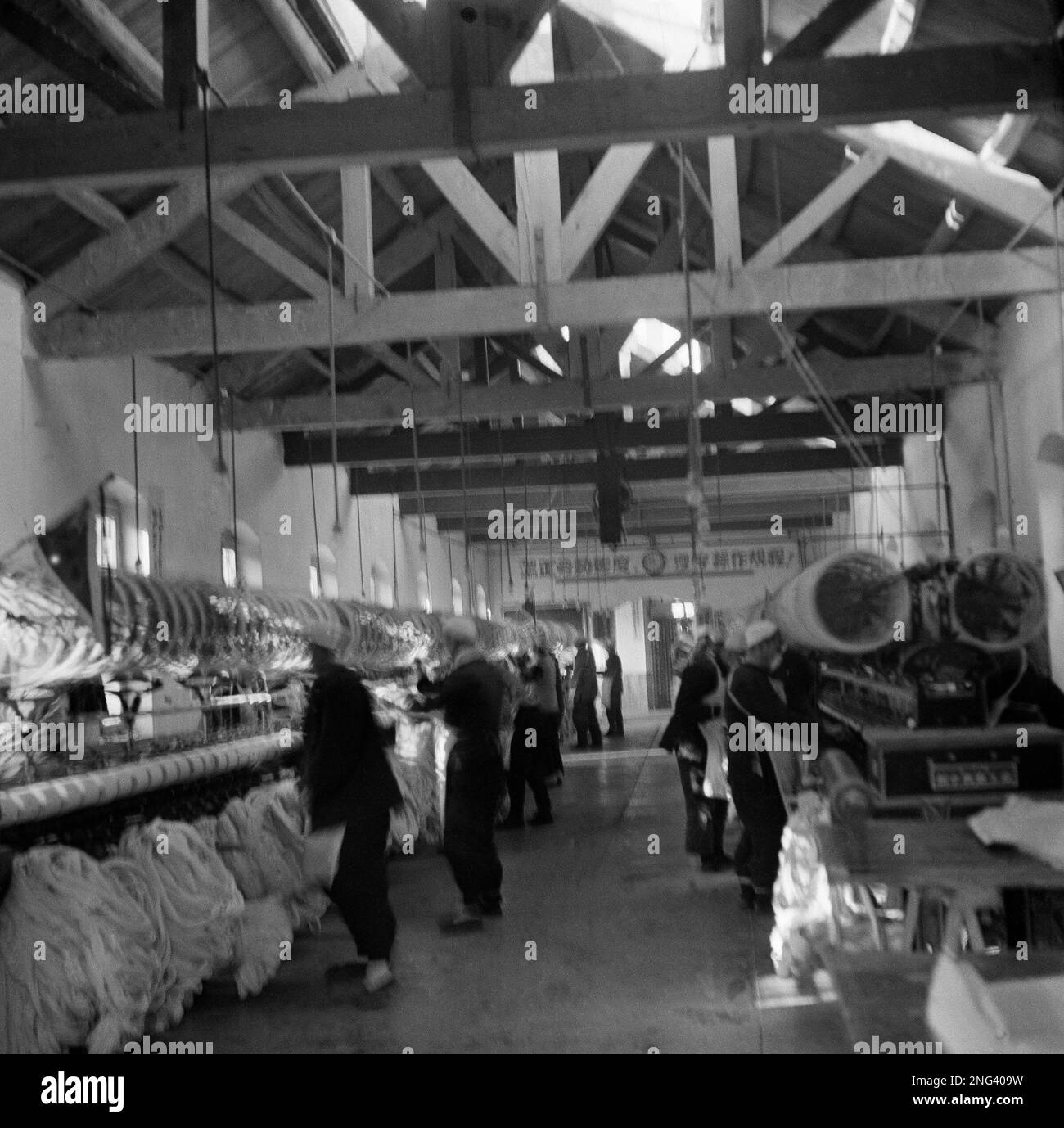 A section of the cotton spinning workshop is shown in the Peking Prison ...