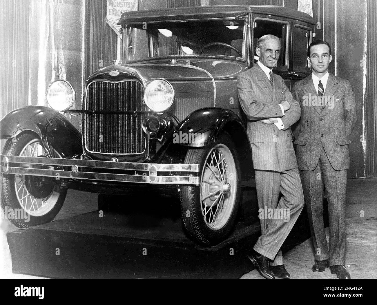Automobile manufacturer Henry Ford, left, and his son Edsel, in one of ...