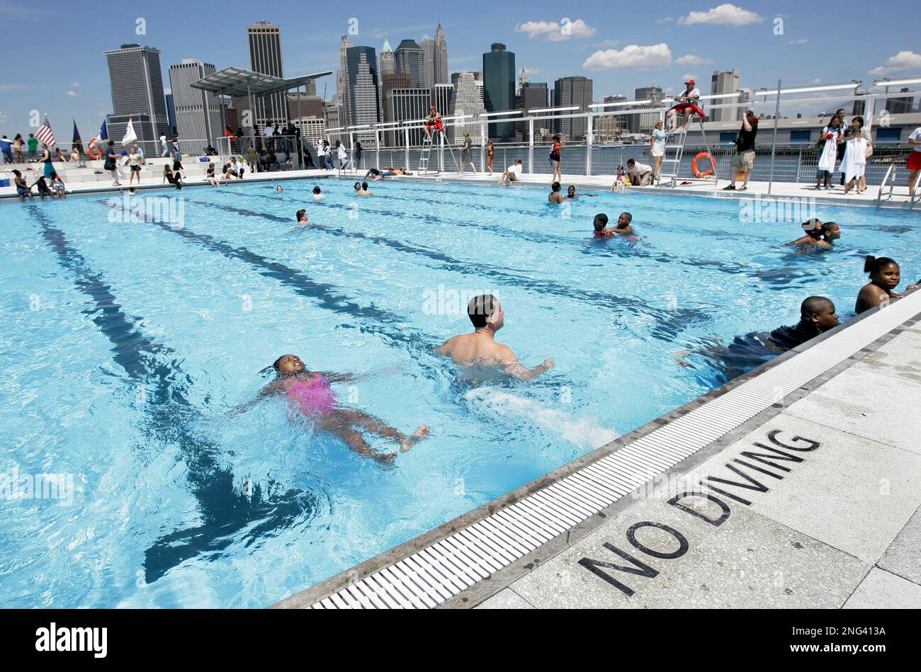 New York City's skyline is visible as Nayhira Baird, 9, and others ...