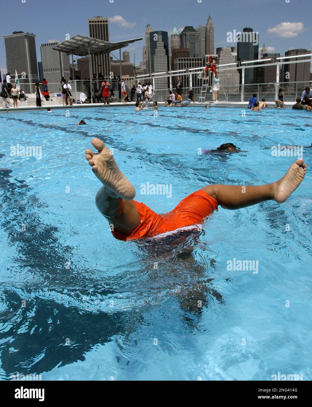 New York City's skyline is visible as Omari Corbin, 9, plays in the ...