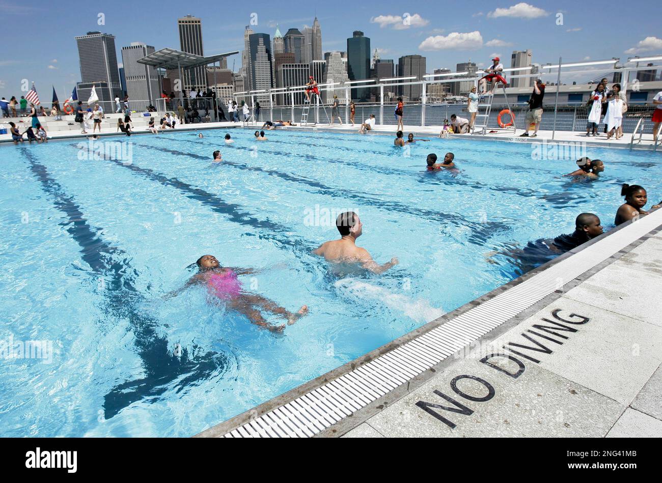 New York City's skyline is visible as Nayhira Baird, 9, and others ...