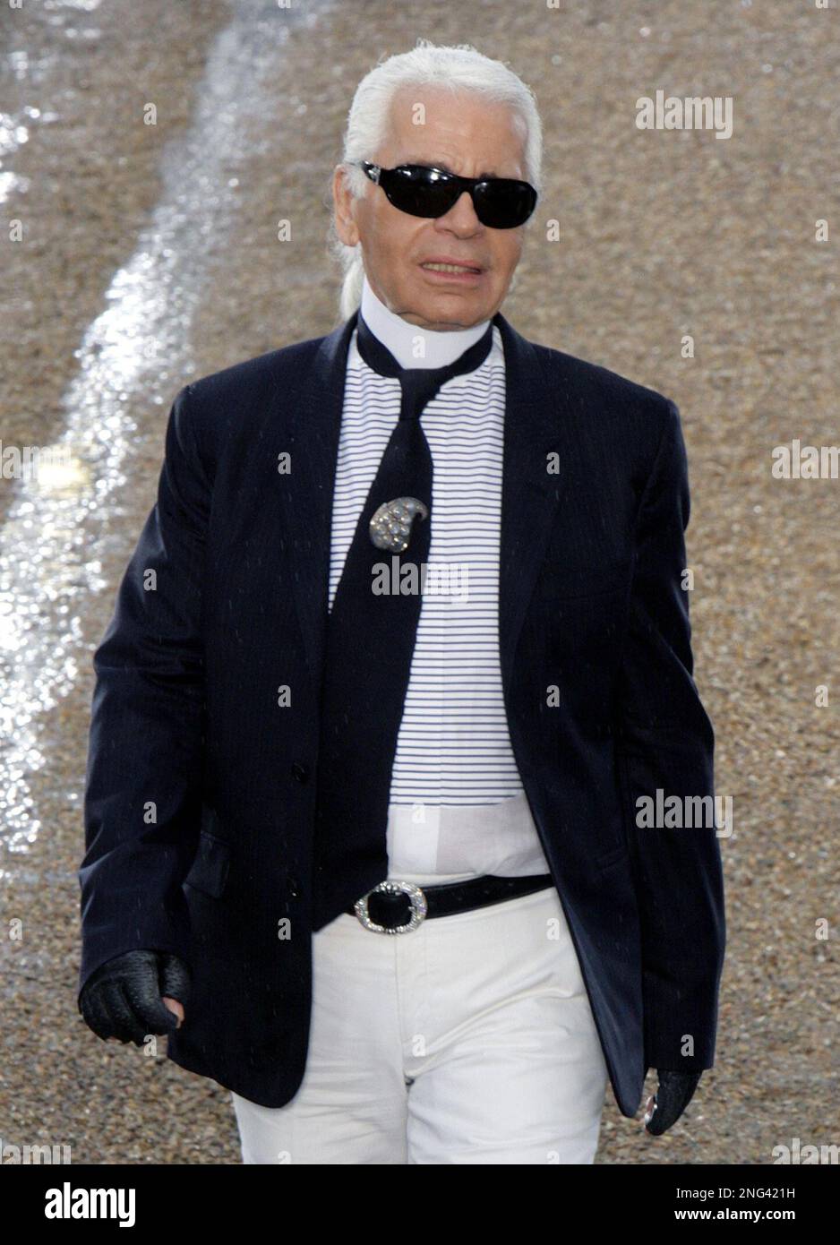 German fashion designer Karl Lagerfeld acknowledges the applause at the ...