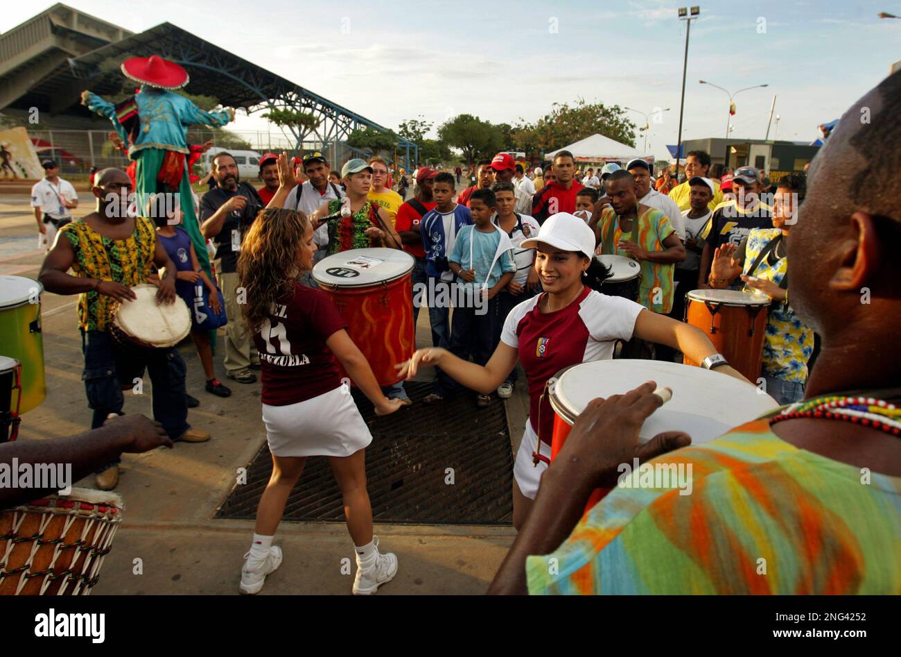 Local entertainers dance outside the stadium prior to the Argentina ...