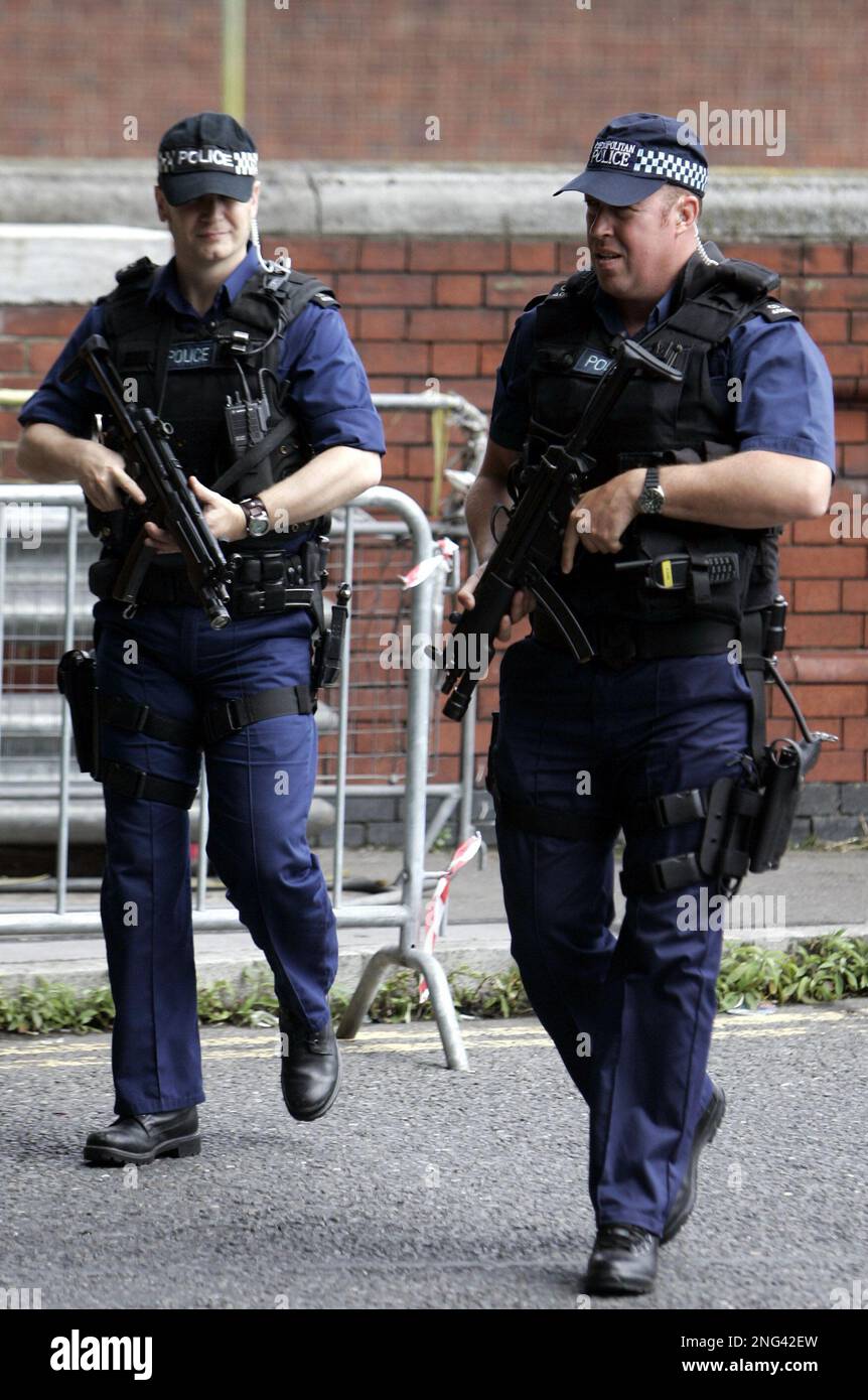British police officers patrol the grounds of the Waterloo train ...