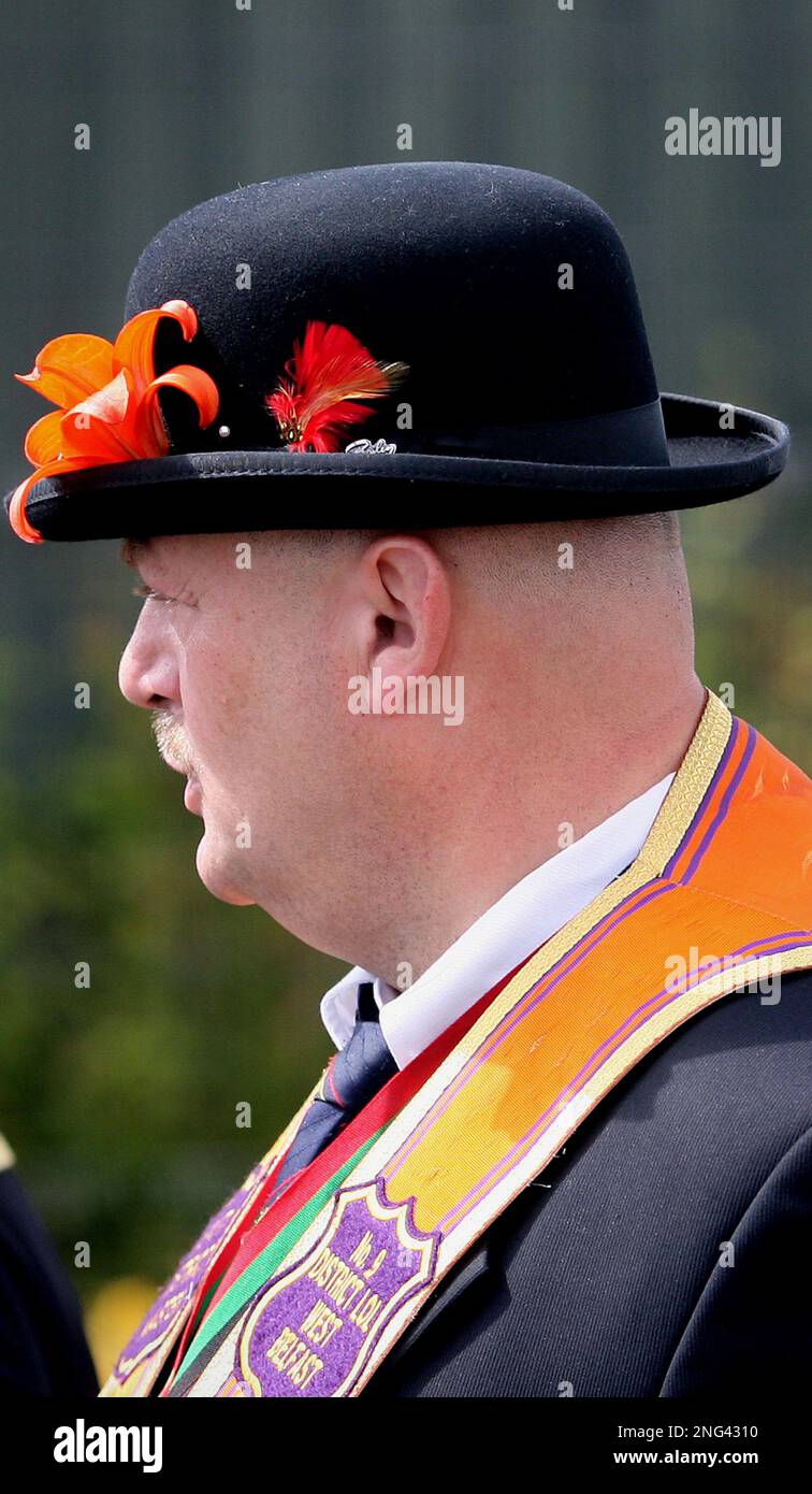 A member of the Orange Order parades through the mainly Roman Catholic ...