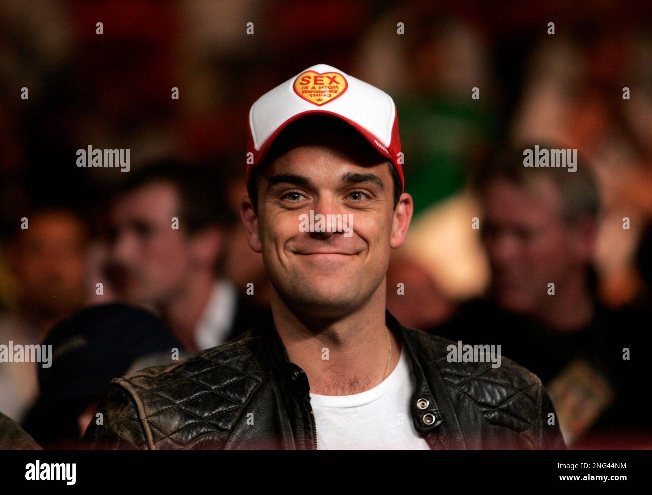 Singer Robbie Williams sits ringside for the Ricky Hatton Jose Luis ...