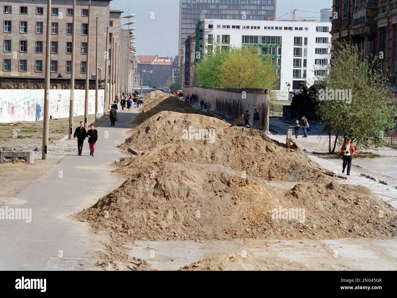 People walk on a former death strip of the Berlin Wall close to ...