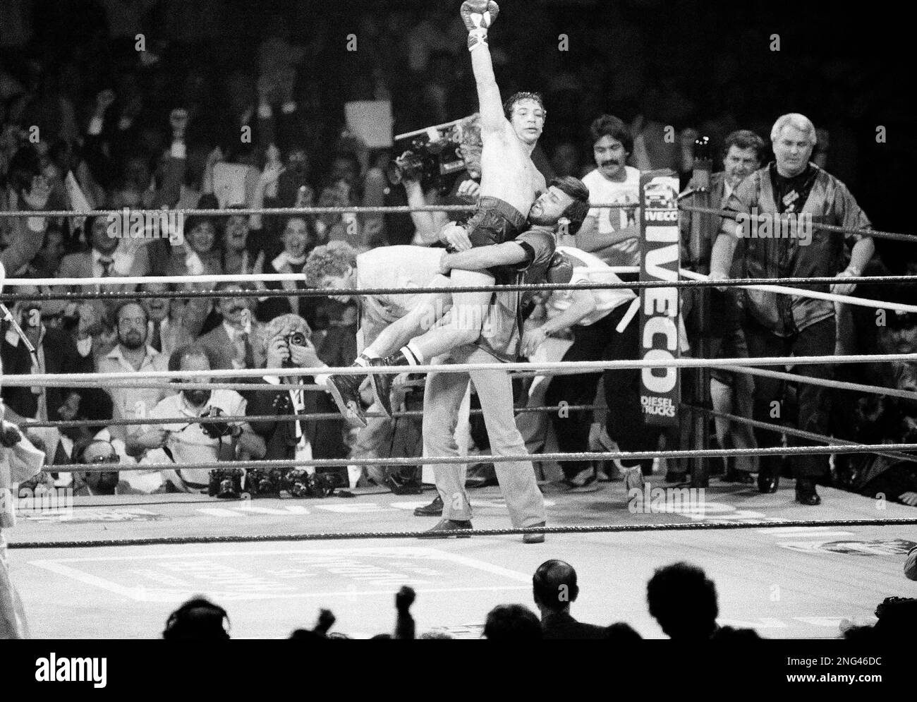 Ray "Boom Boom" Mancini is raised in the air by one of his handlers ...