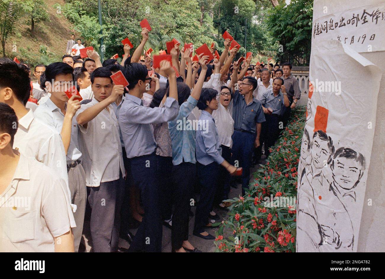 Pro Communist Chinese wave red-covered books of Mao Tse Tung's ...