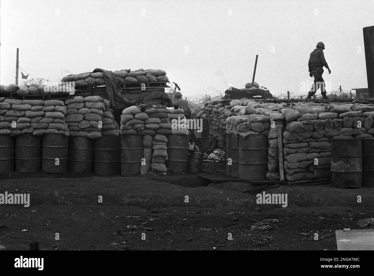 Sandbags surround two soldiers dug in to position at the U.S. Marine ...