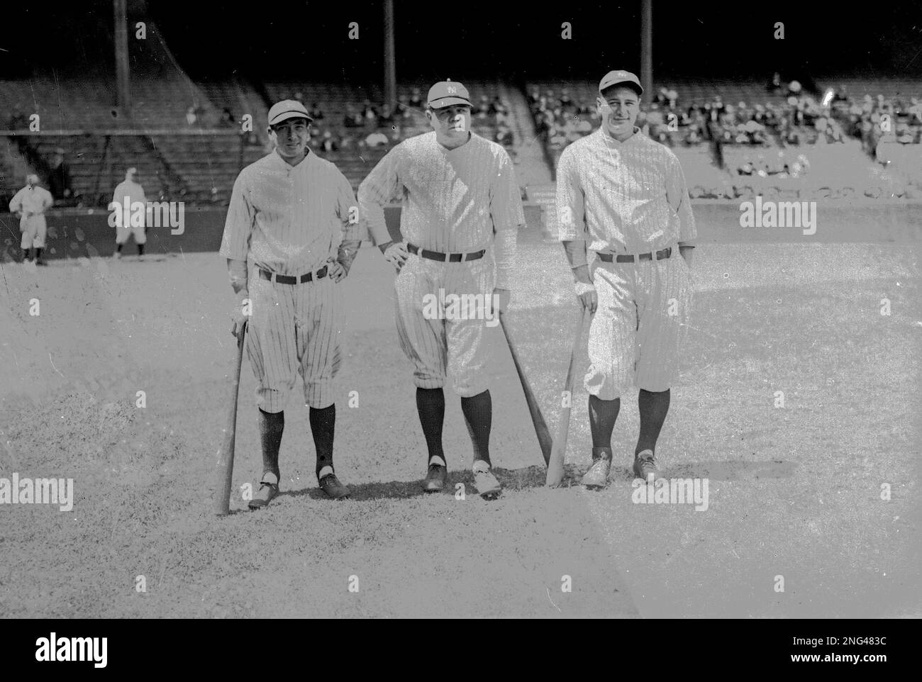 Home run king Babe Ruth of the New York Yankees, center, is seen with ...