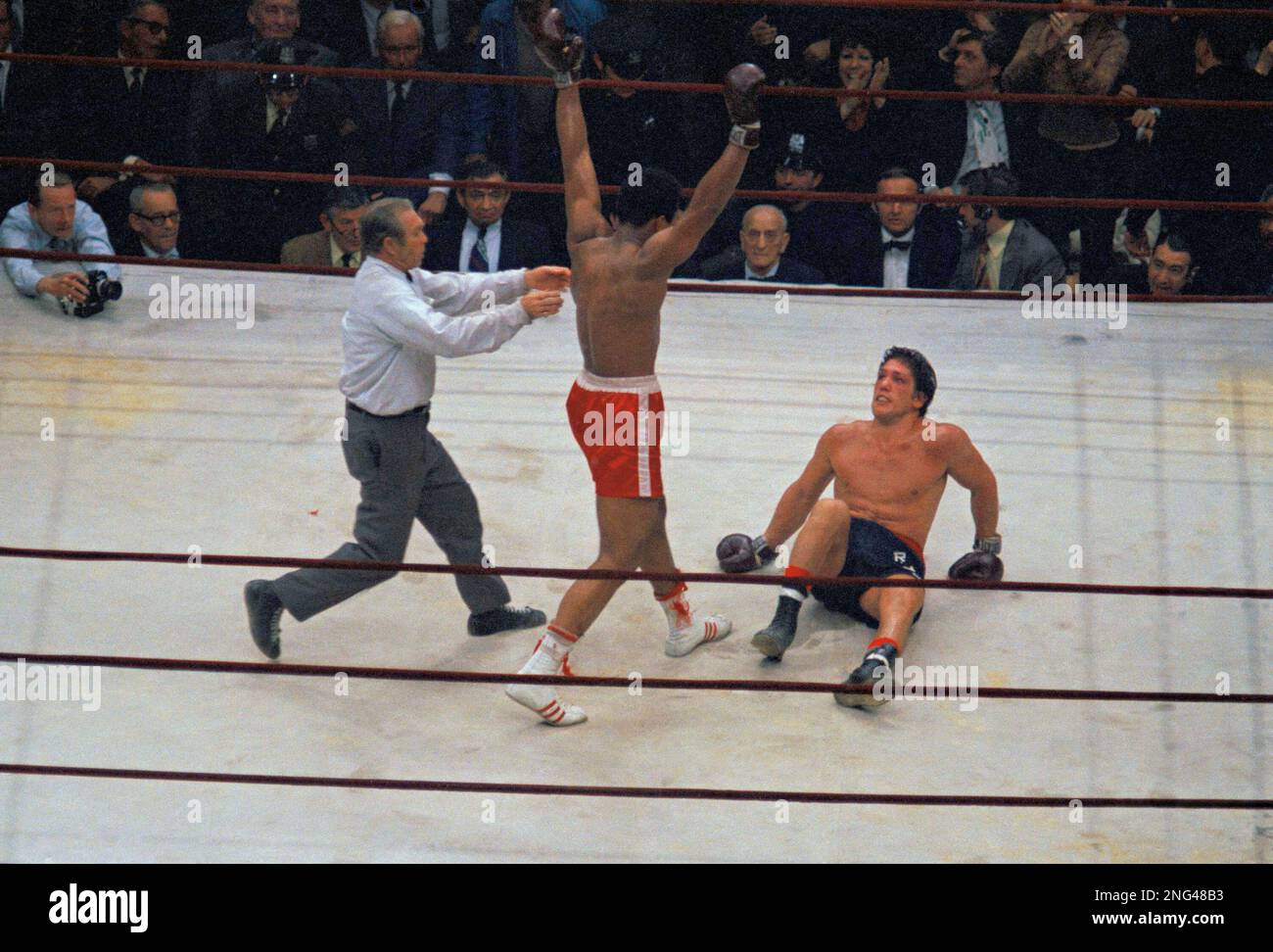 Muhammad Ali with arms raised stands over Oscar Bonavena in triumph in ...