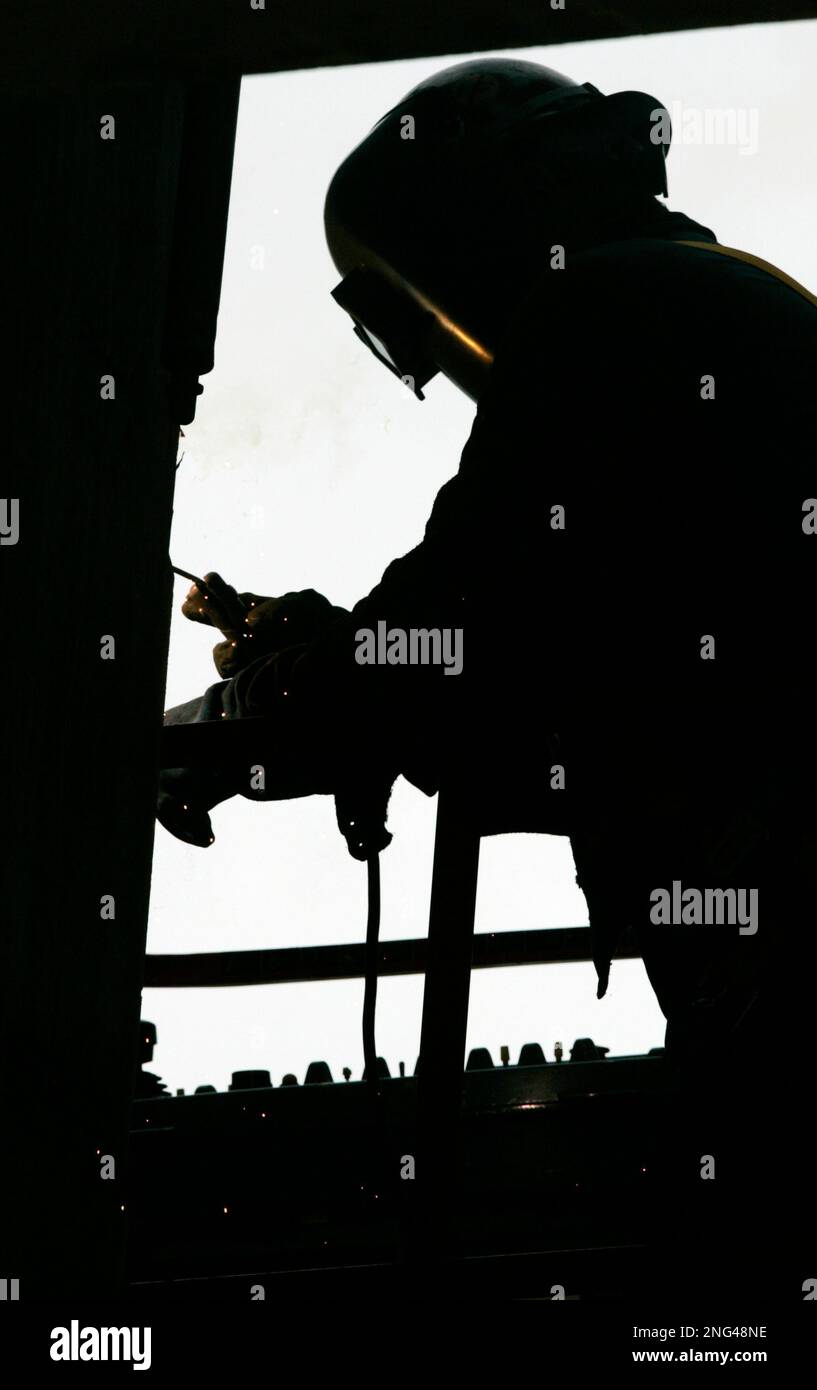A welder works as construction continues at Citi Field, the new stadium ...