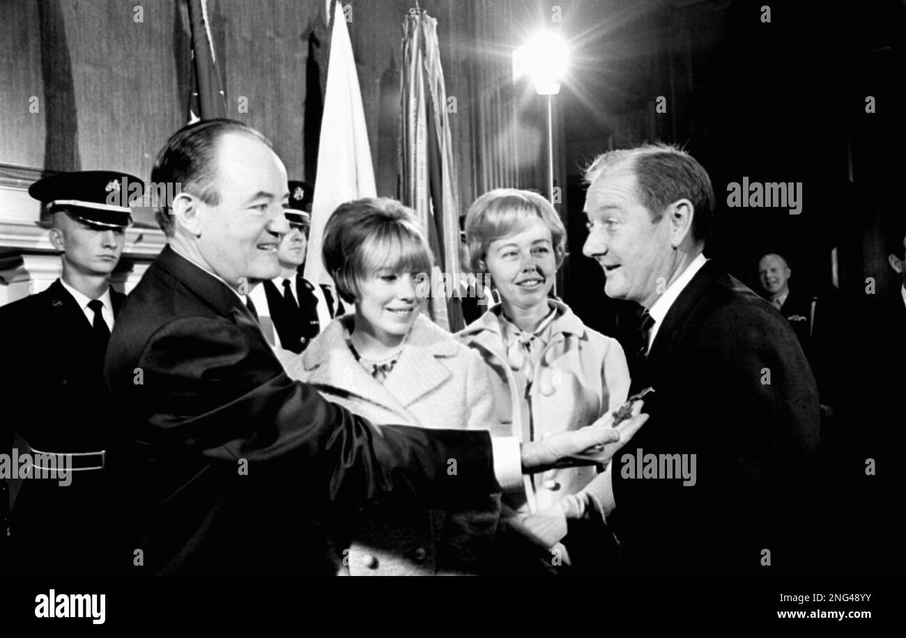 Vice President Hubert Humphrey admires the Distinguished Service Cross ...