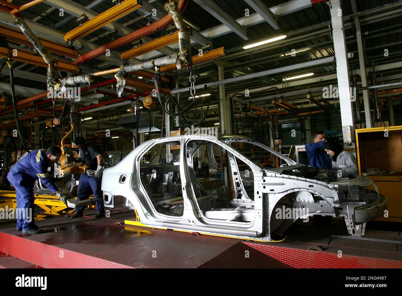 Moroccan workers at the Renault Logan assembly line at the Somaca ...