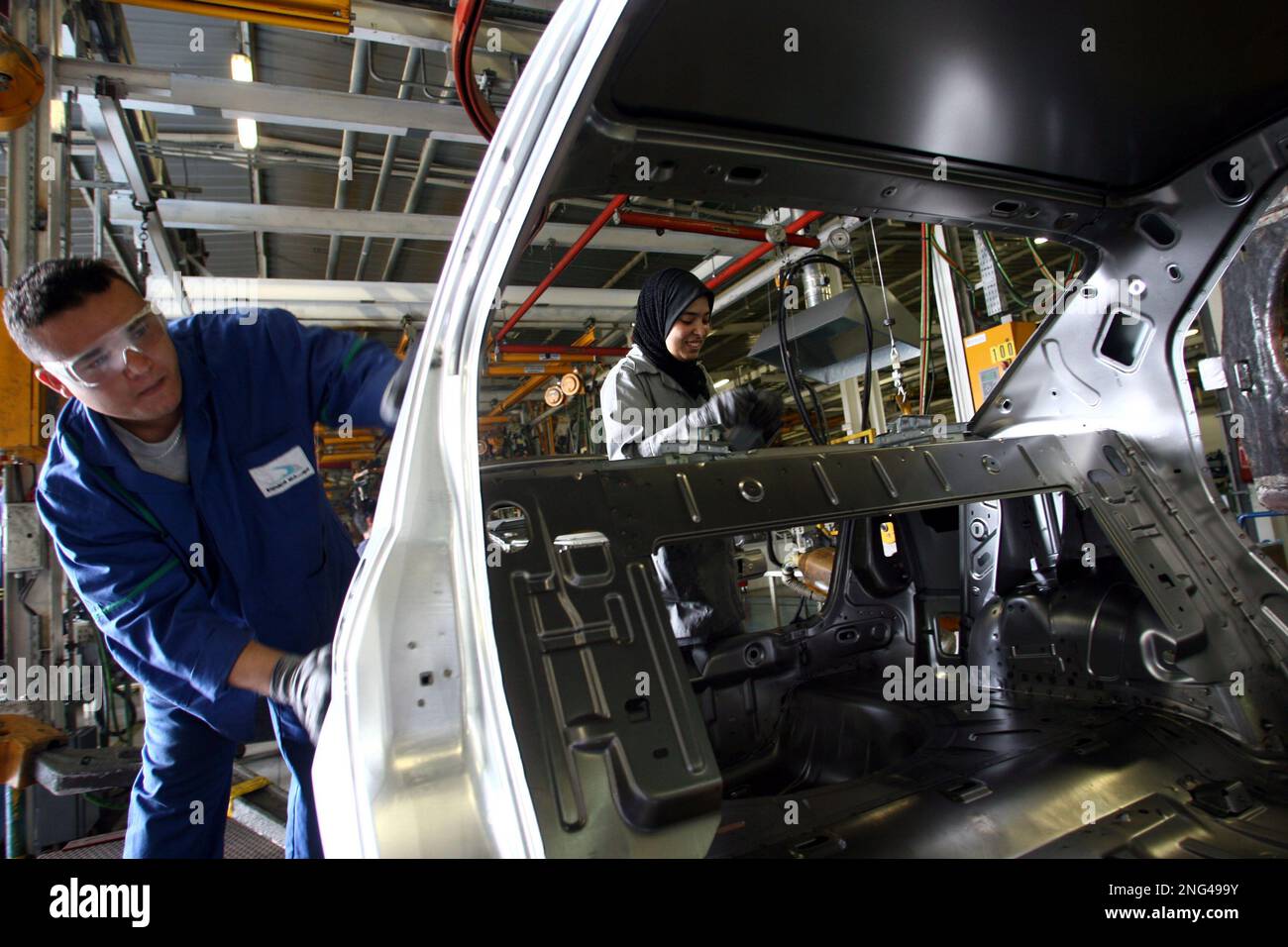 Moroccan workers at the Renault Logan assembly line at the Somaca ...