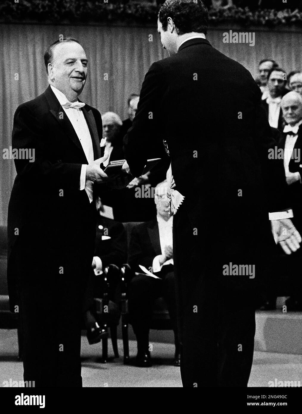 Baruj Benacerraf, left, shakes hands with King Carl Gustaf of Sweden in ...