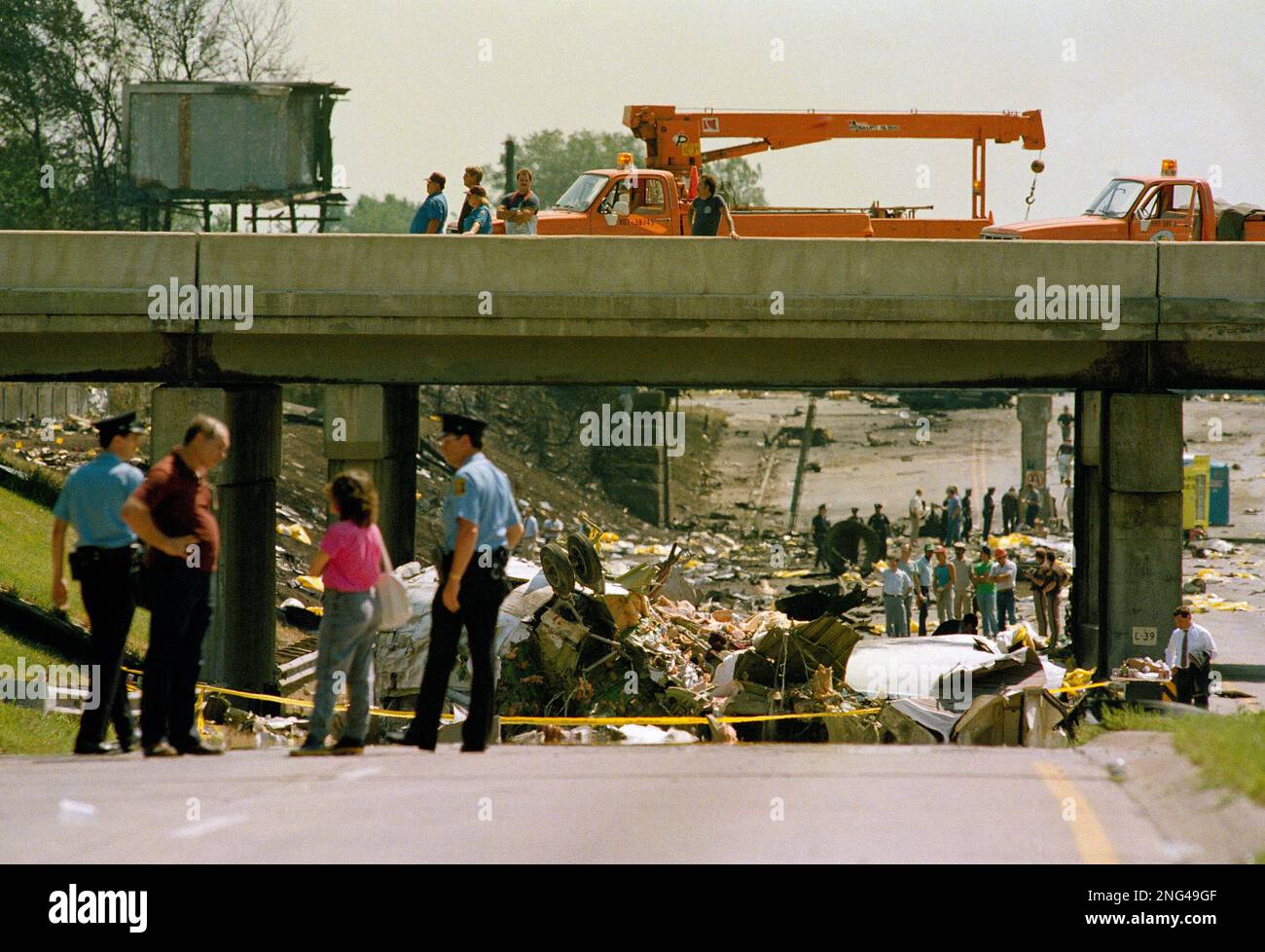 Debris from the crash of a Northwest Airlines MD-80 is strewn across ...