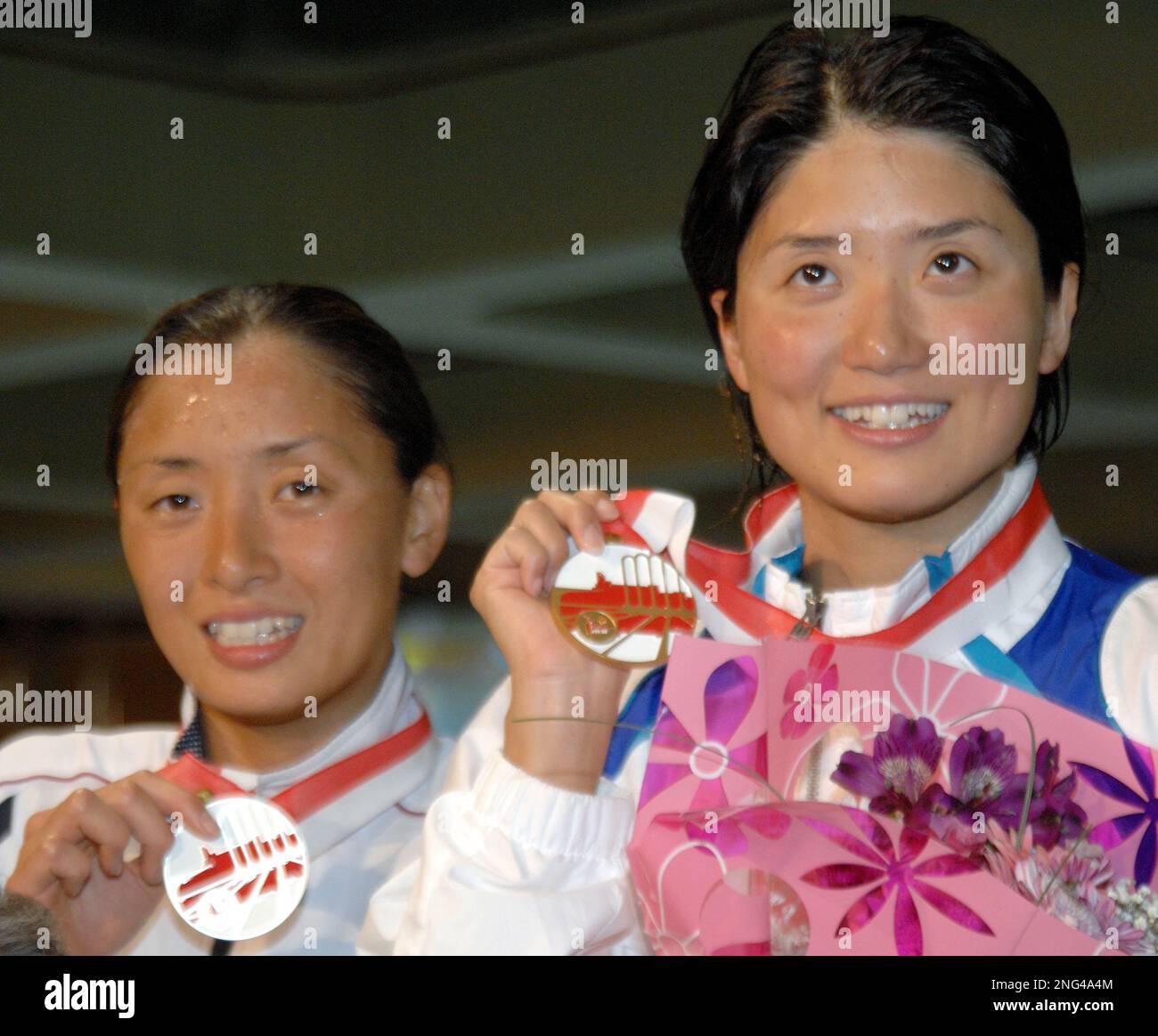 Japan's Reiko Nakamura, right, and Hanae Ito show their medals after ...