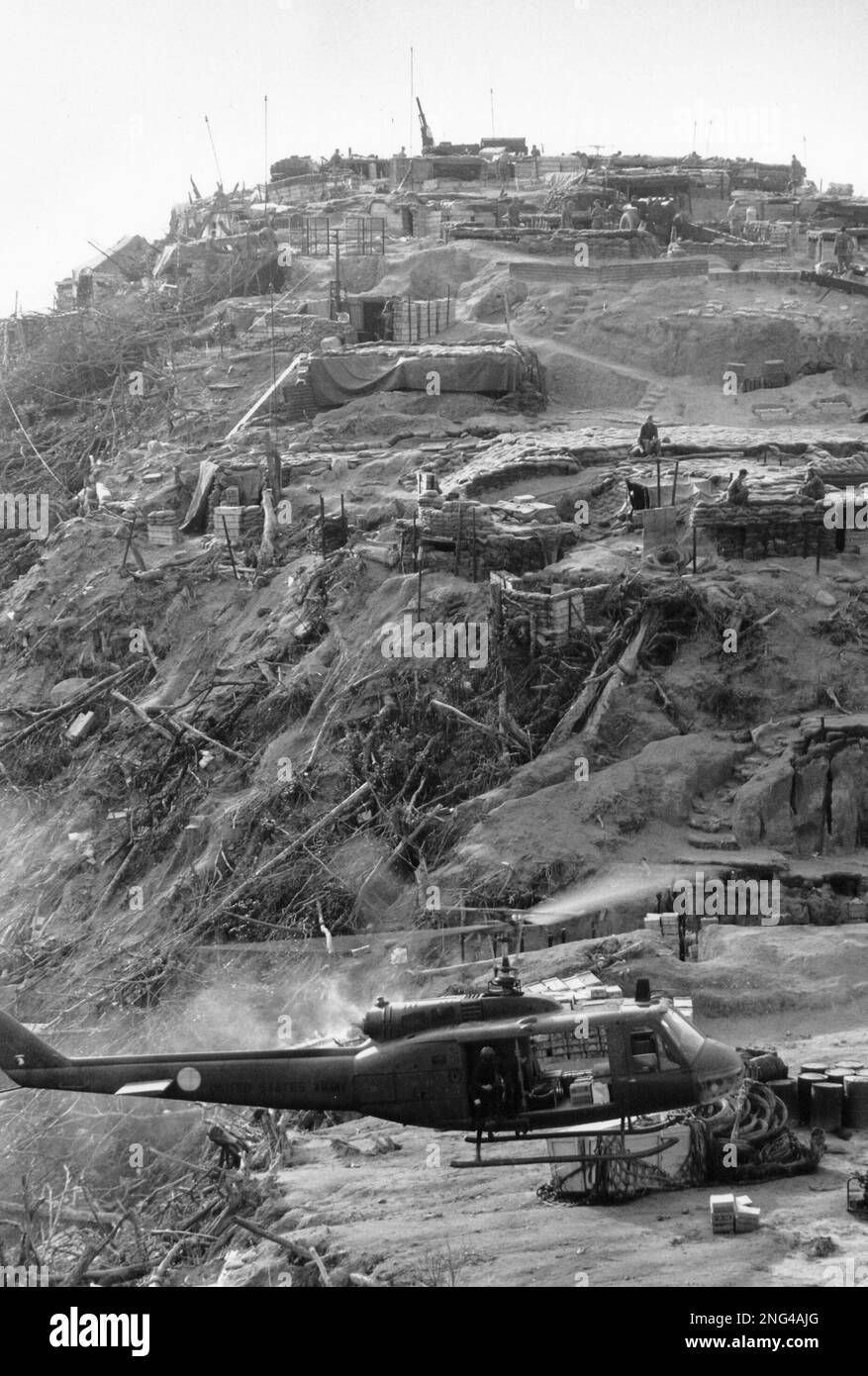 A resupply helicopter settles into heavily-fortified Firebase ...