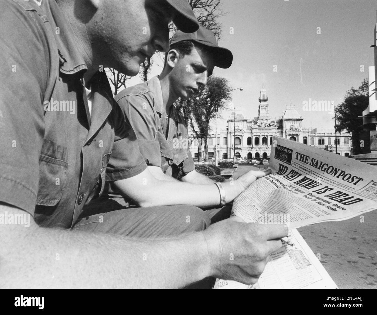 GIs read a Saigon newspaper's story of the death of North Vietnamese ...