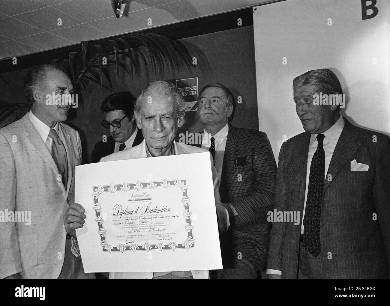 American writer Samual Fuller, center, shows his diploma as member of ...