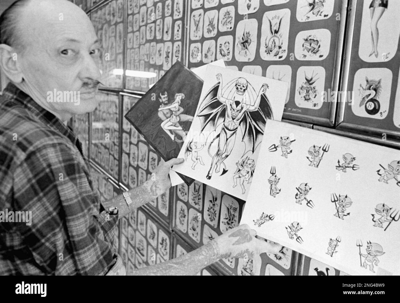 Veteran tattoo artist Gib "Tatts" Thomas displayes a variety of devil ...