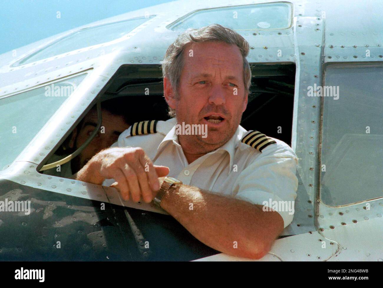 Captain of hijacked TWA jet John L. Testrake talks to reporters from ...