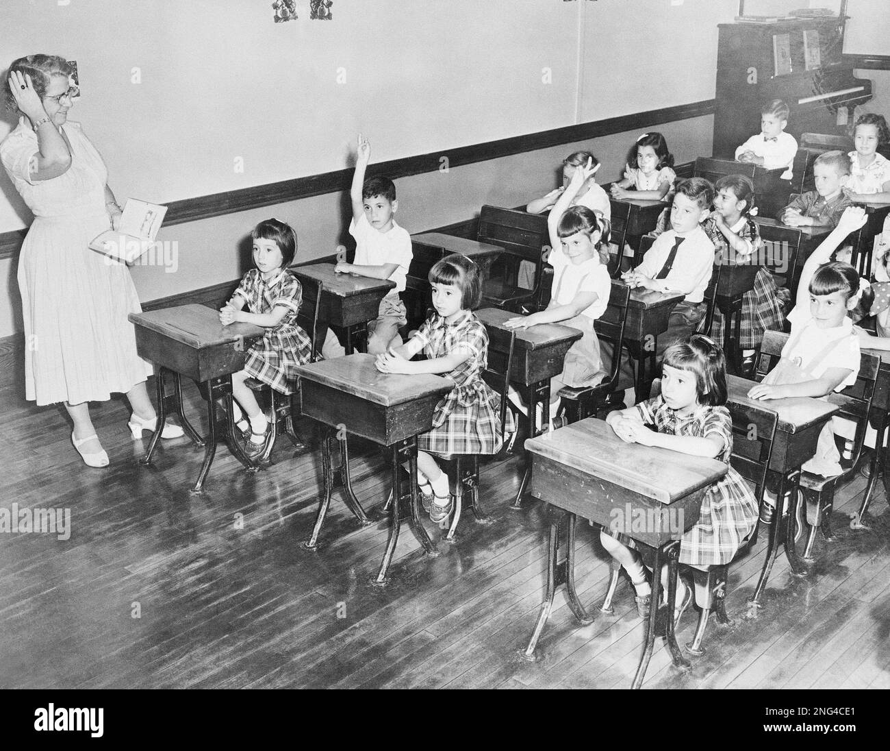 First grade teacher Mrs. Helen Lenon faces the double dilemma of trying ...