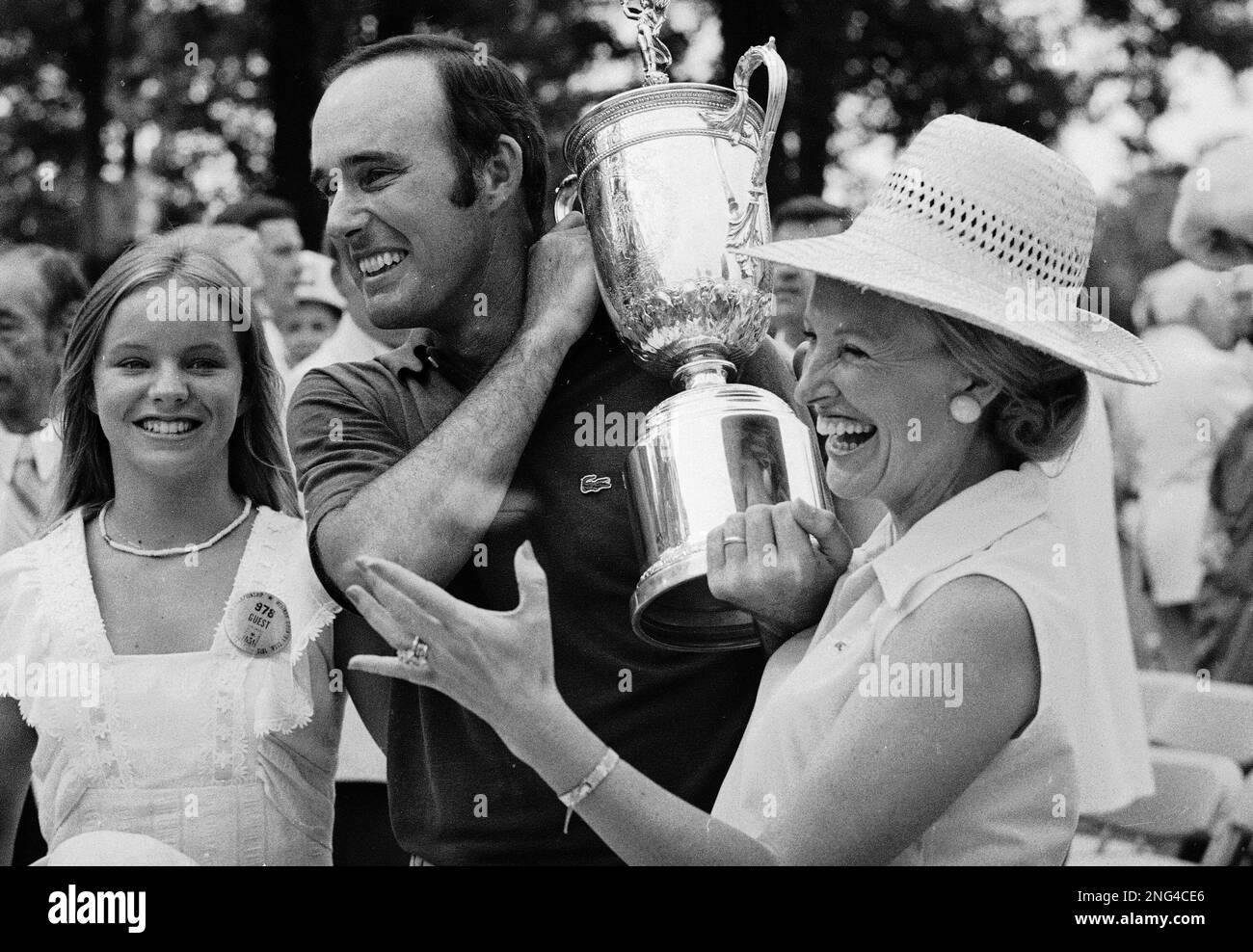 Lou Graham is flanked by his daughter, Louanne, left, and his wife ...