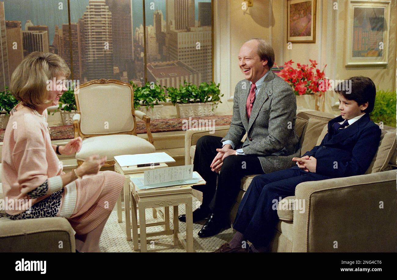 Robert Tobin , 11, of Quincy , Mass., right, sits with cartoonist Jim ...