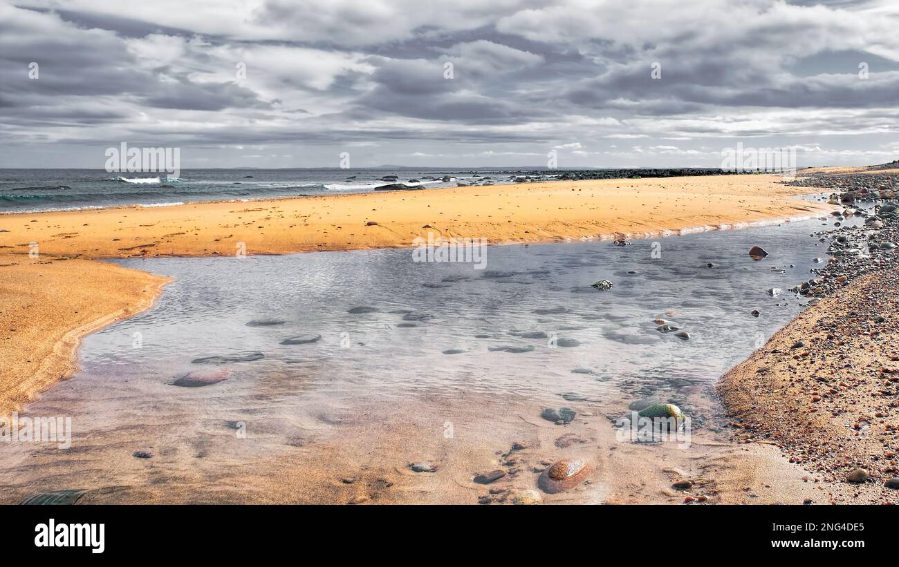 A rock pool on Brora beach Stock Photo - Alamy