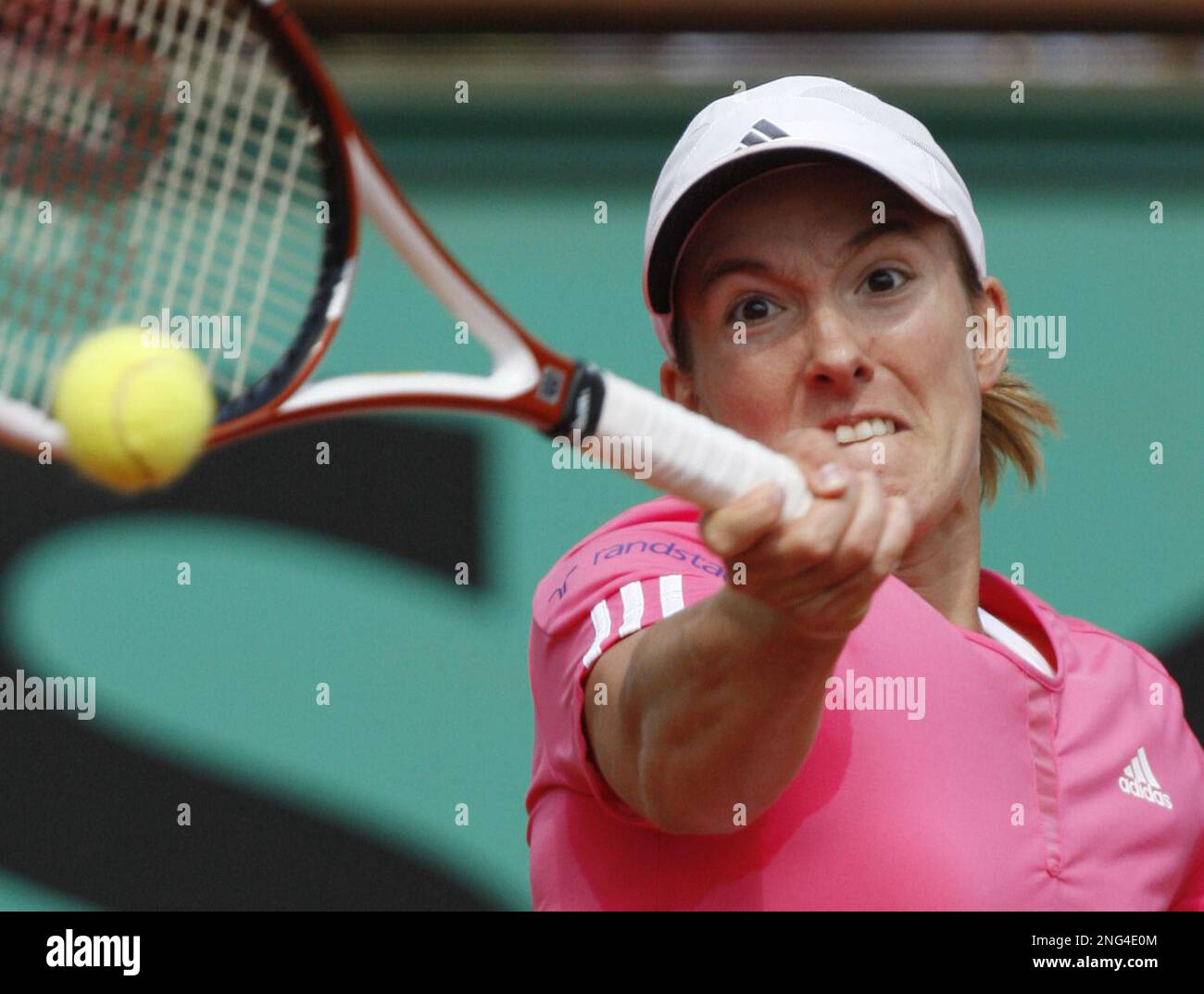 Belgium's Justine Henin slams a forehand to Serbia's Ana Ivanovic ...