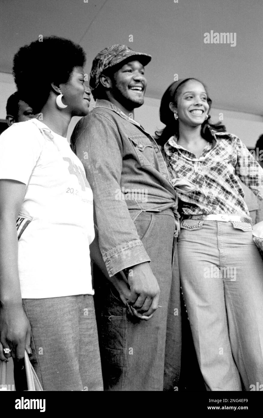Heavyweight boxer George Foreman says goodbye to two unidentified young ...