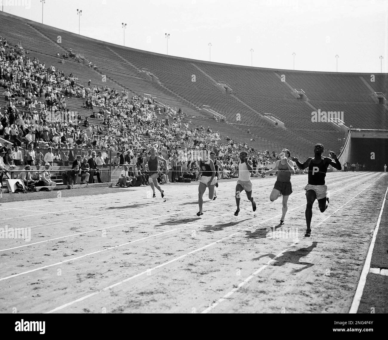 Mack Robinson, right, is shown winning the 200-meters dash in the far ...
