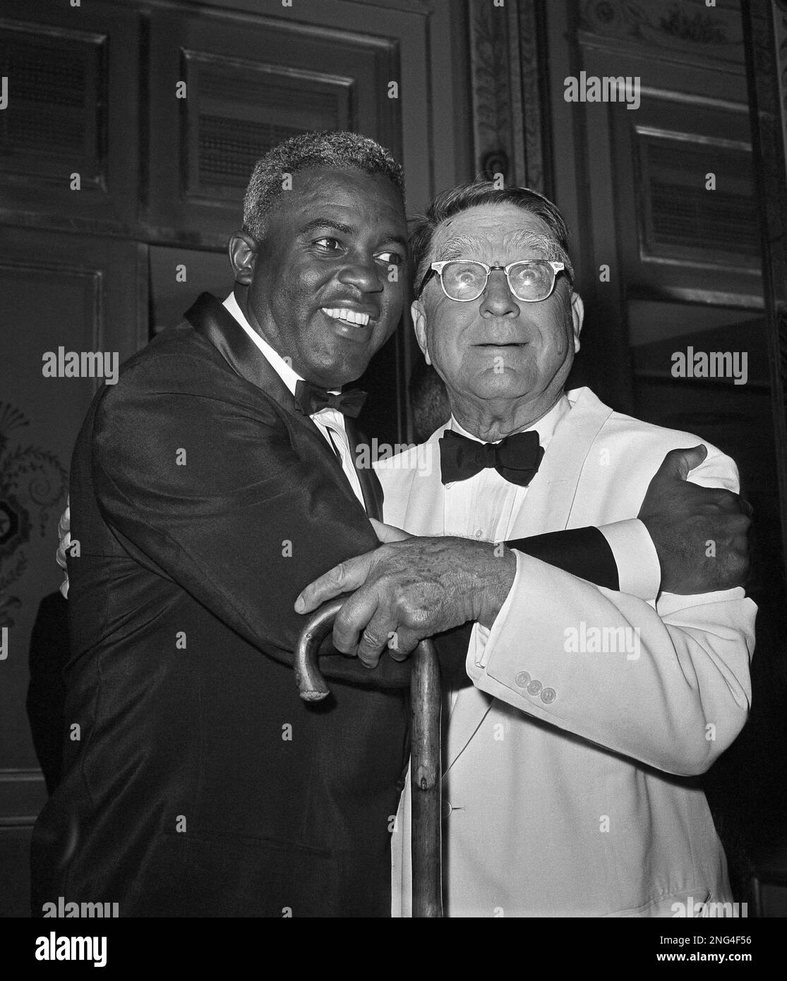 Baseball player Jackie Robinson embraces Branch Rickey in New York ...