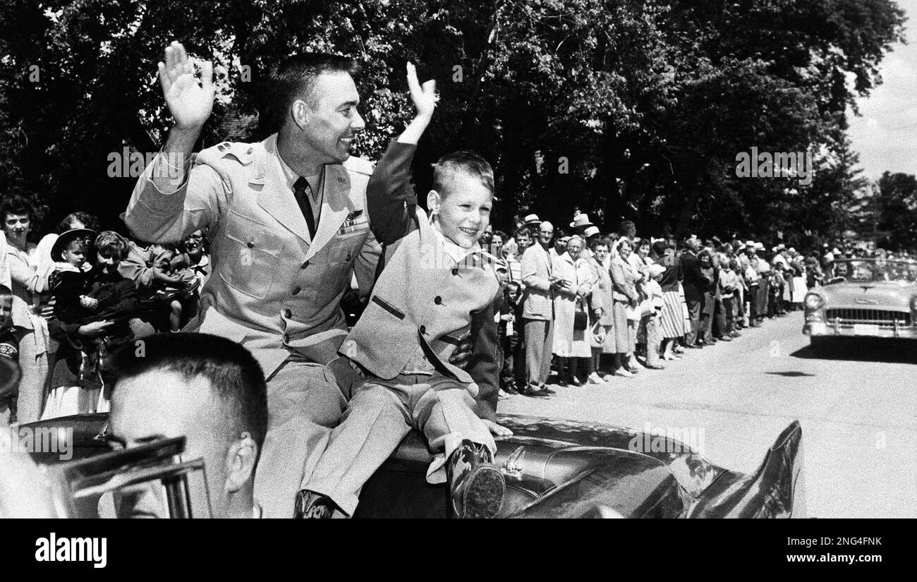 Captain Harold Fisher and his son,Harrold III wave at the crowds as ...
