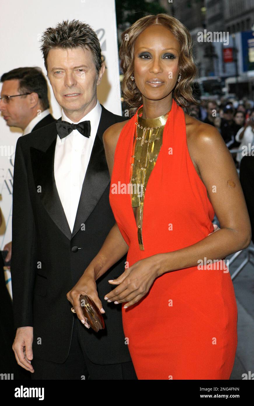 Musician David Bowie, left, and model Iman pose for a photo at the CFDA ...