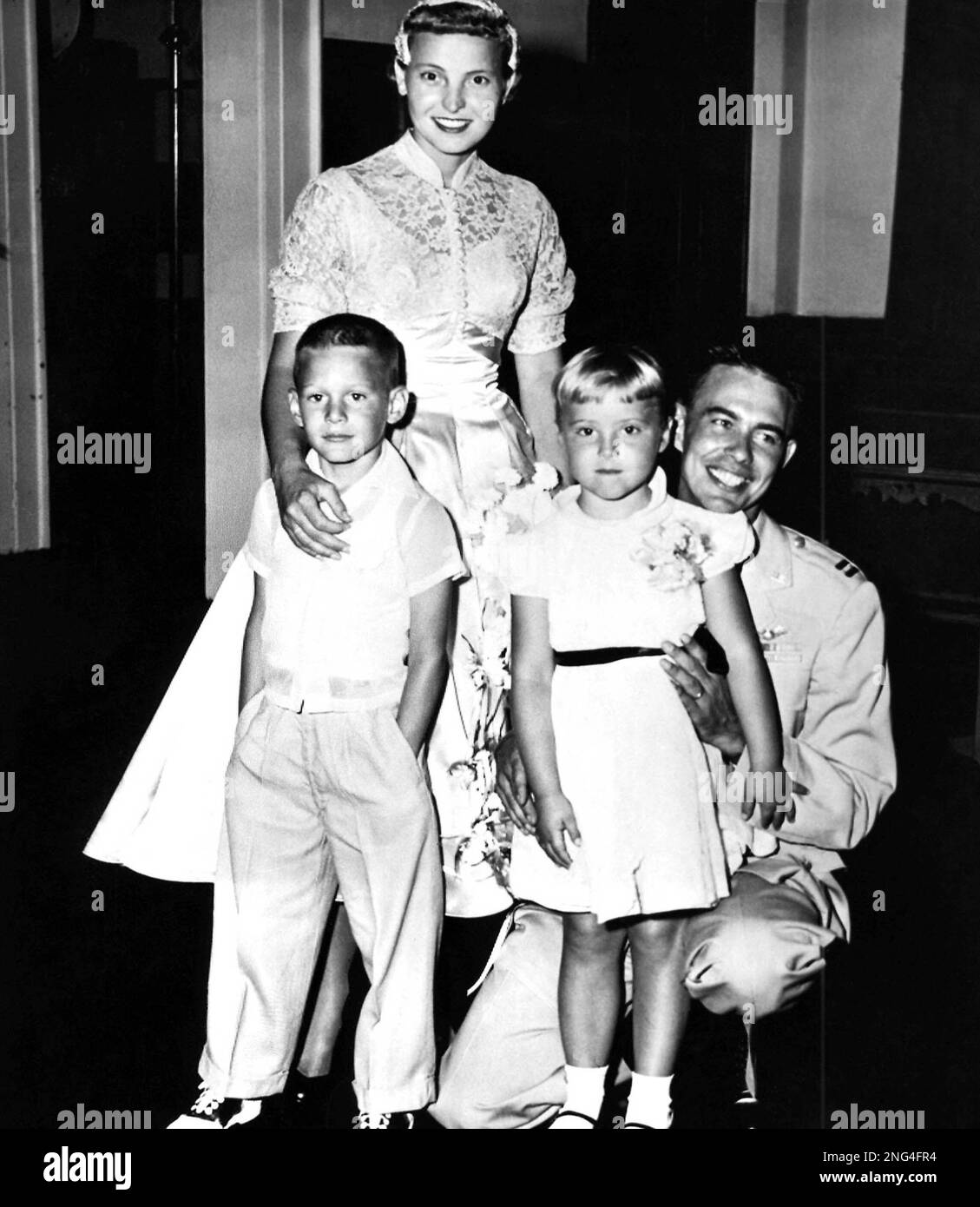 Capt. Harold Fischer Jr. pictured with his wife, son Harold III, and ...