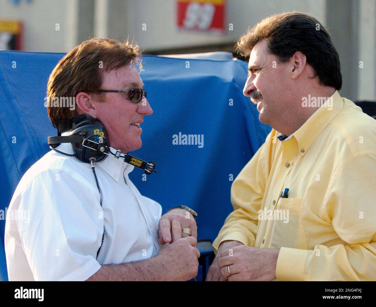 Richard Childress, left, talks with NASCAR president Mike Helton, right ...
