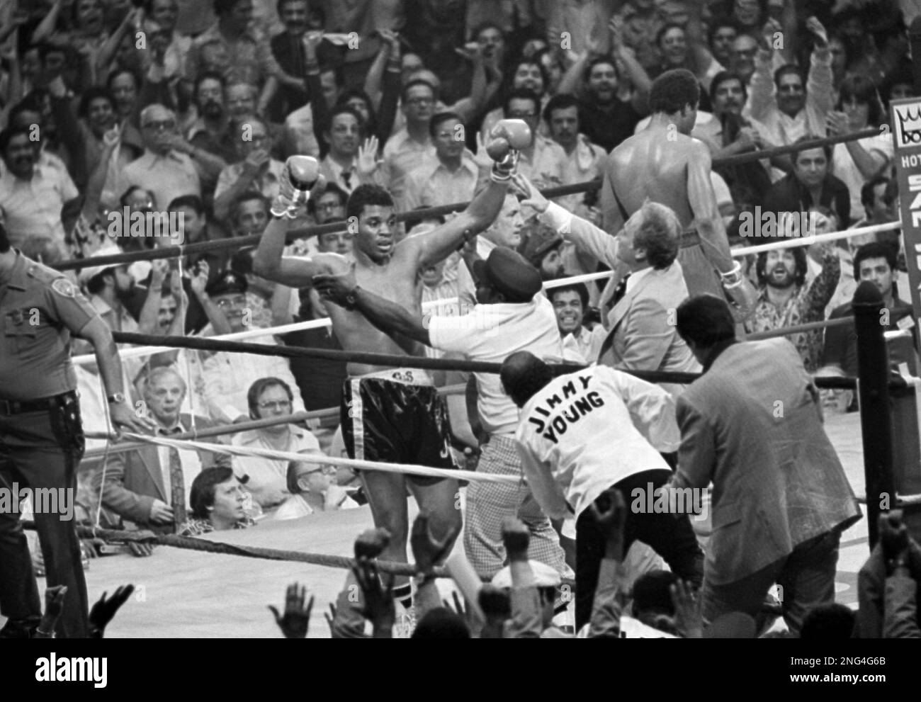 Heavyweight boxer Jimmy Young throws up his arms in victory at the end ...