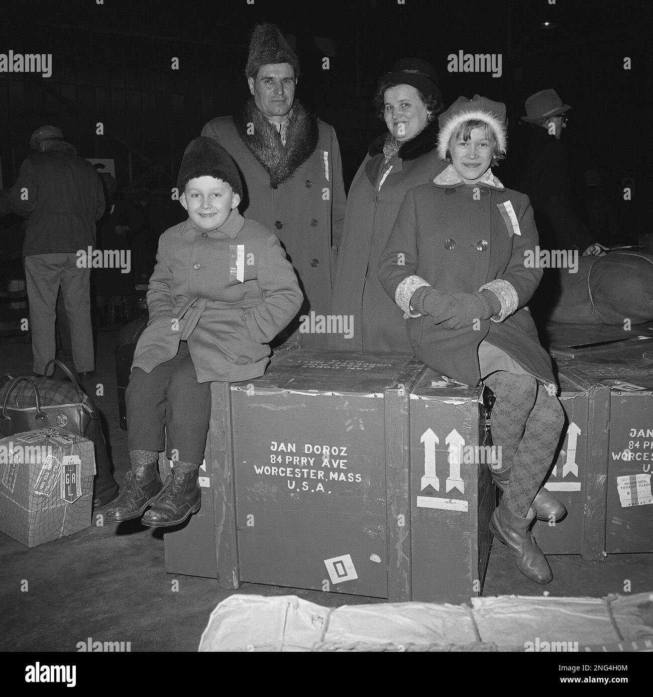 Passengers line the deck of the Polish ship M.S. Batory as she docked ...
