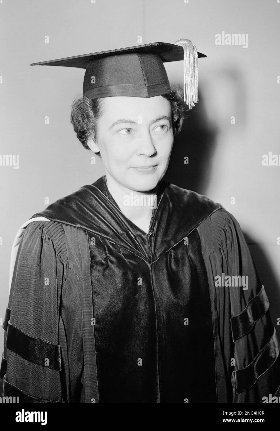Miss Margaret Clapp, 39, wears traditional cap and gown as she is ...