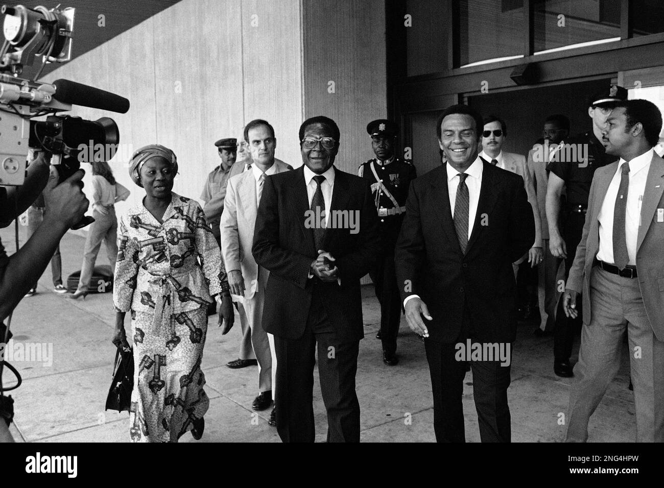 Zimbabwe Prime Minister Robert Mugabe, left, is accomponied to his ...
