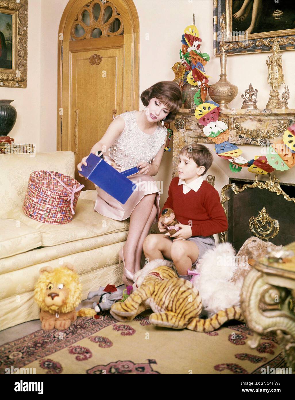 Italian actress Gina Lollobrigida sits with her son, Milko Skofic ...