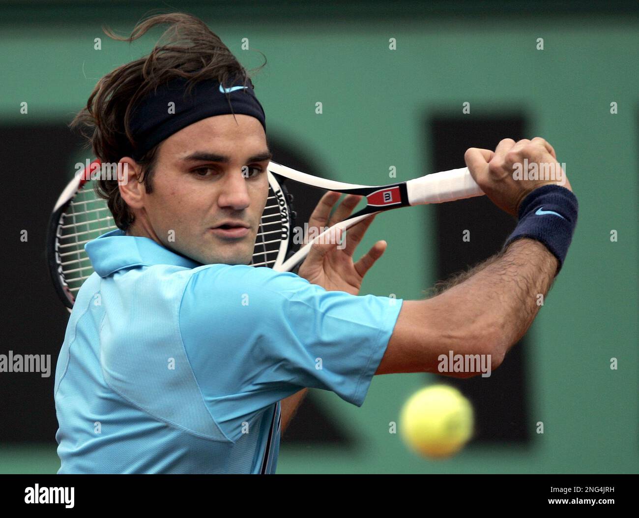 Roger Federer, of Switzerland prepares to backhands Russia's Mikhail ...