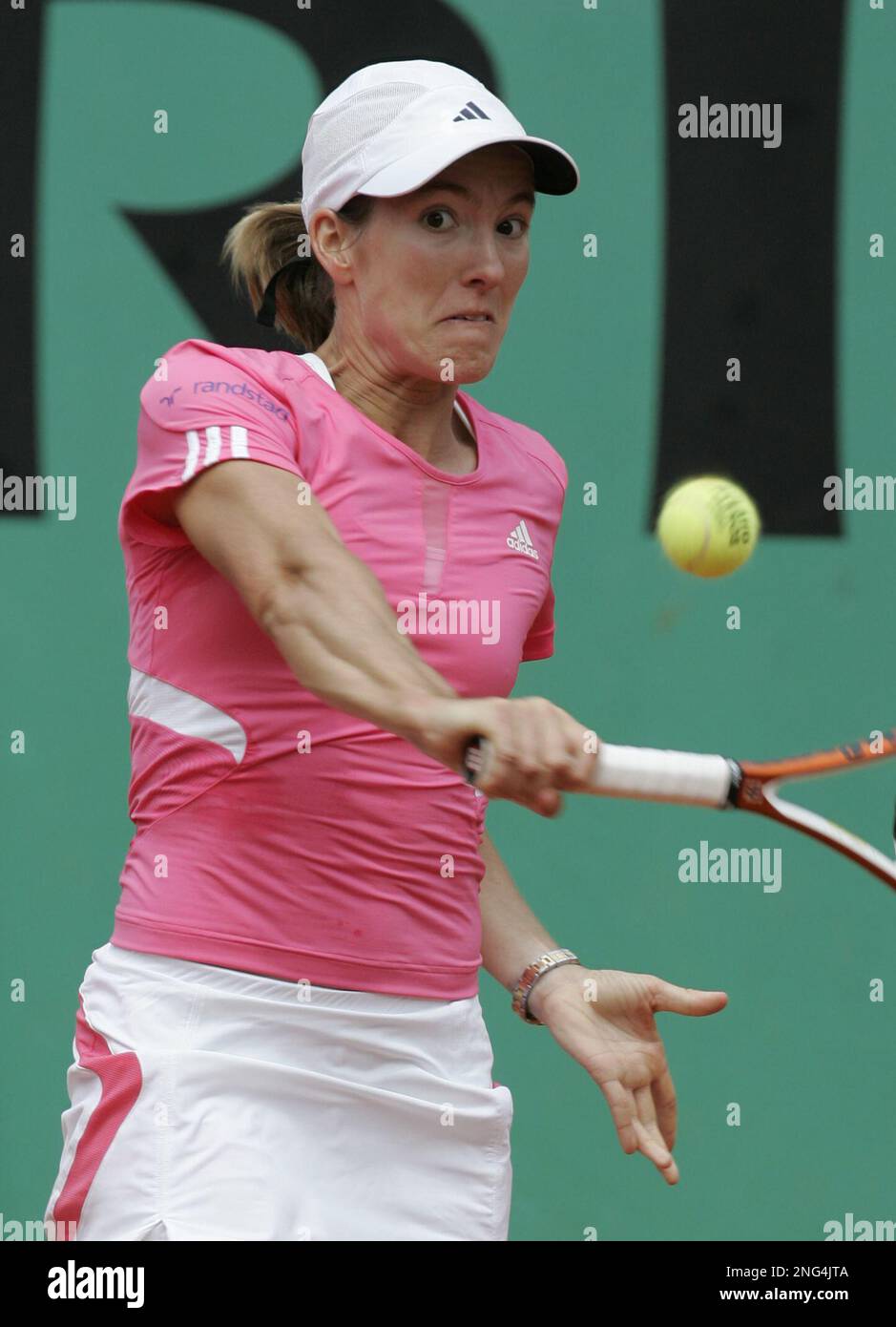 Defending champion Belgium's Justine Henin backhands to Austria's ...