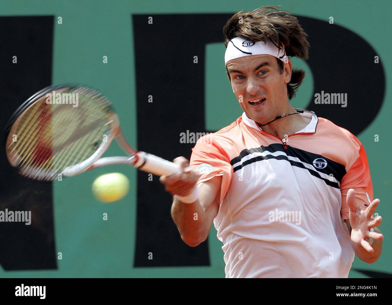 Tommy Robredo, of Spain, returns a ball to Italy's Filippo Volandri ...