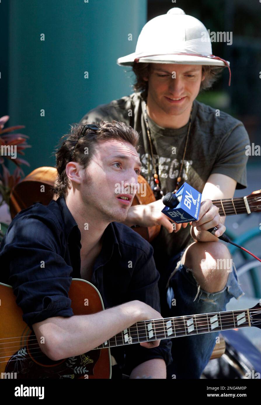 Joe Sumner, lead singer of the music group Fiction Plane, holds the ...