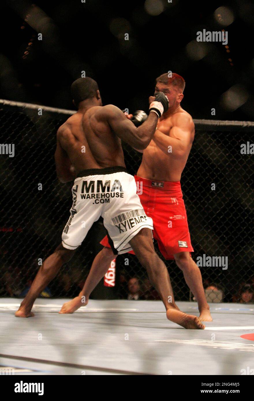Din Thomas, left, throws a right hand against Jeremy Stephens at UFC 71 ...